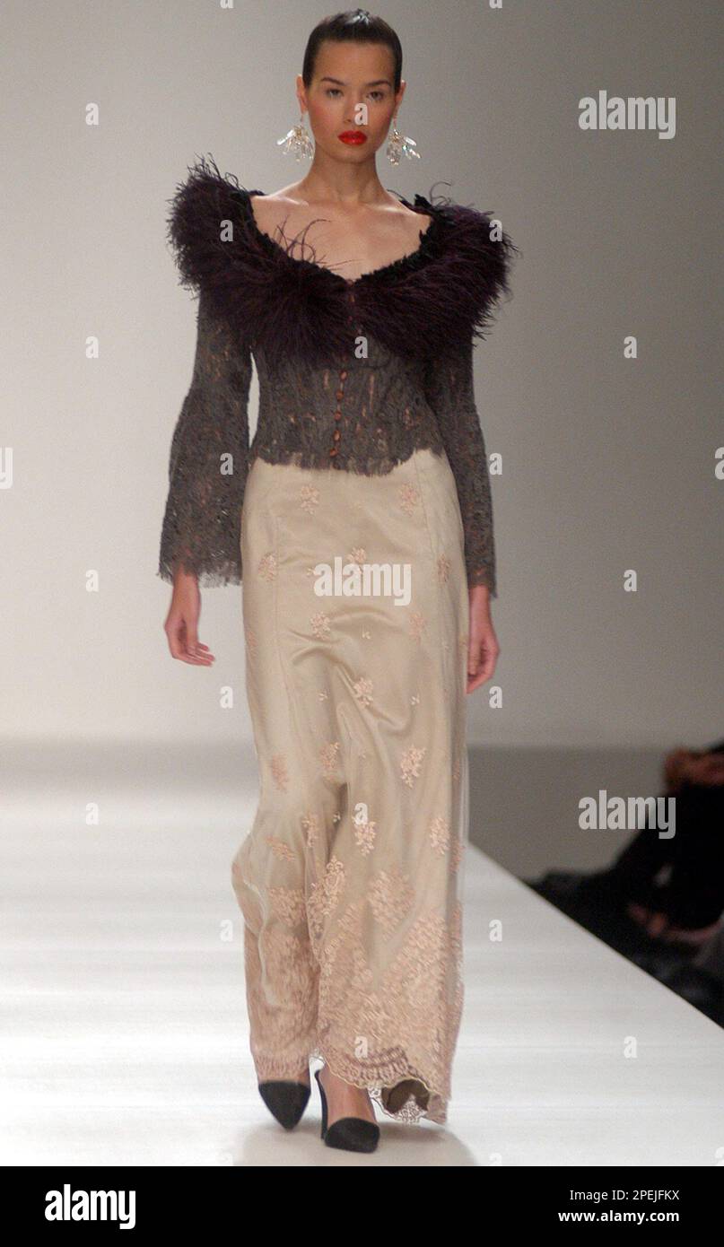 A model presents creations designed by Somchai Khewthong during ELLE ...