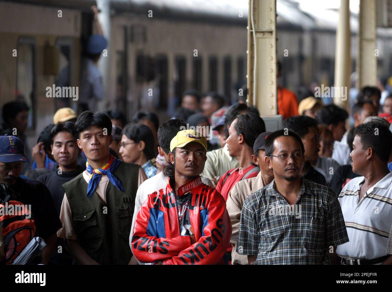 Indonesians crowd a train at Senen train station in Jakarta, Indonesia ...