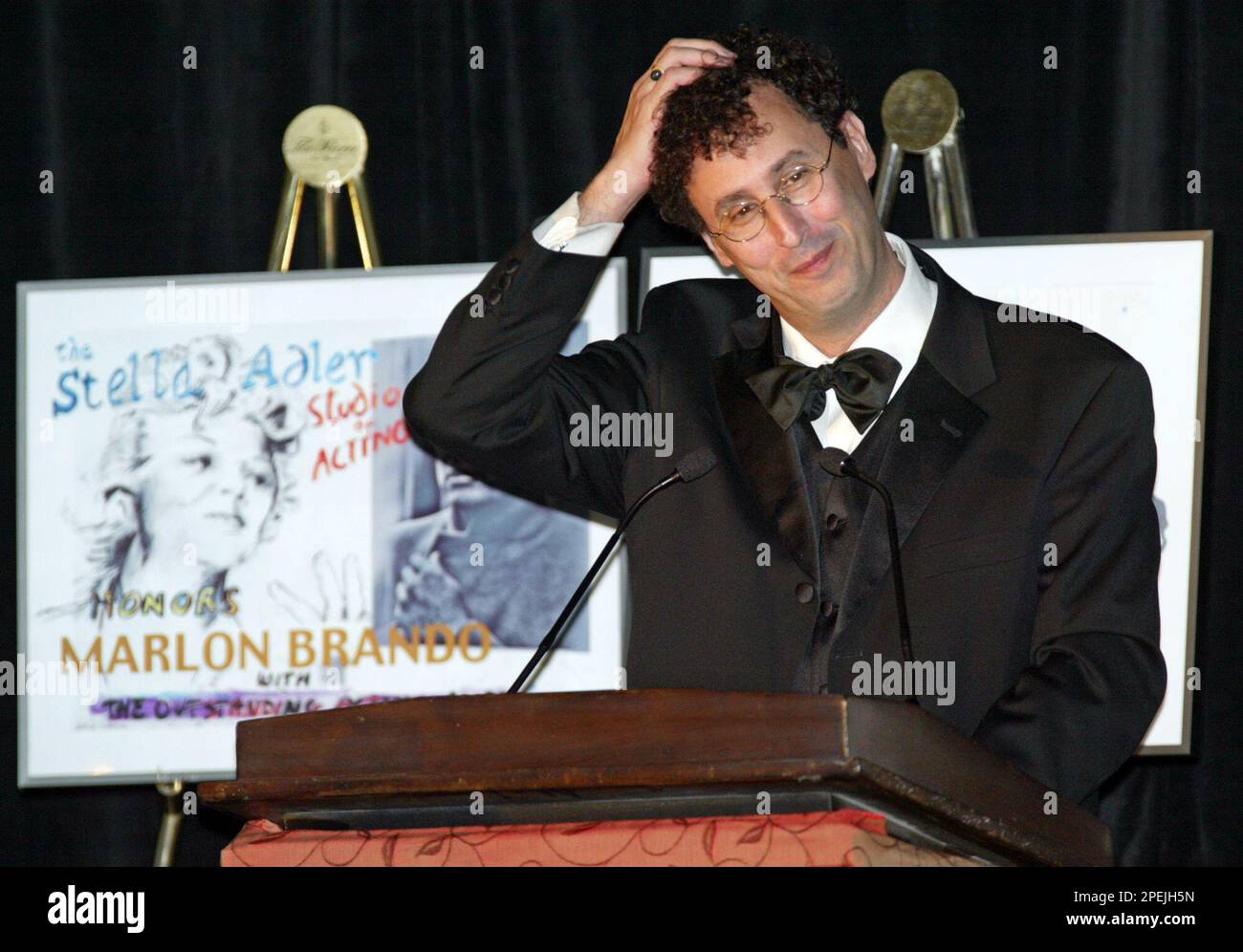 Tony Kushner gestures before making his acceptance speech after being ...