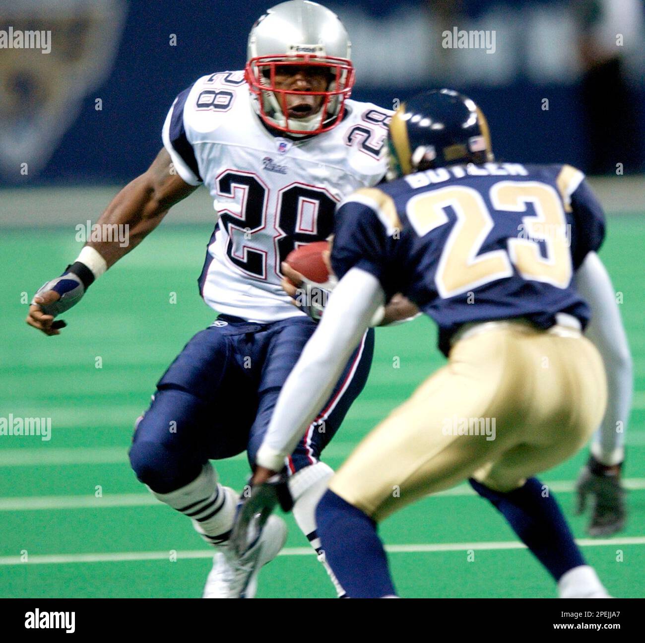 New England running back Corey Dillon (28) looks for room to run ...