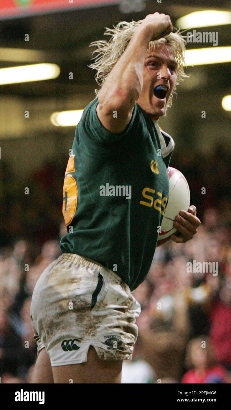 South Africa's Percy Montgomery celebrates scoring a try against Wales ...