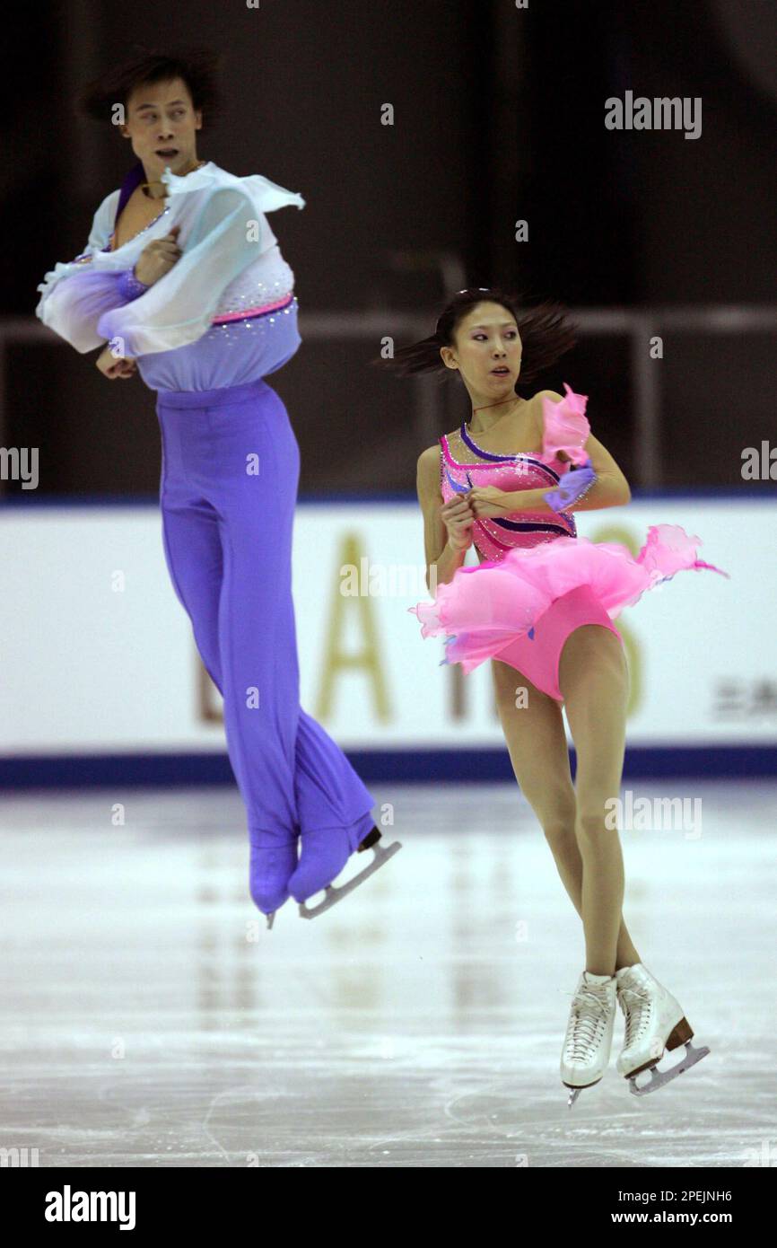 Chinese pair Pang Qing, right, and Tong Jian jump into the air during ...