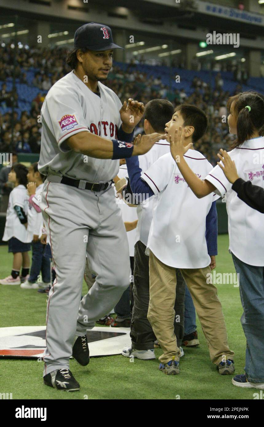 Giving a high-five with children World Series MVP Manny Ramirez of the ...
