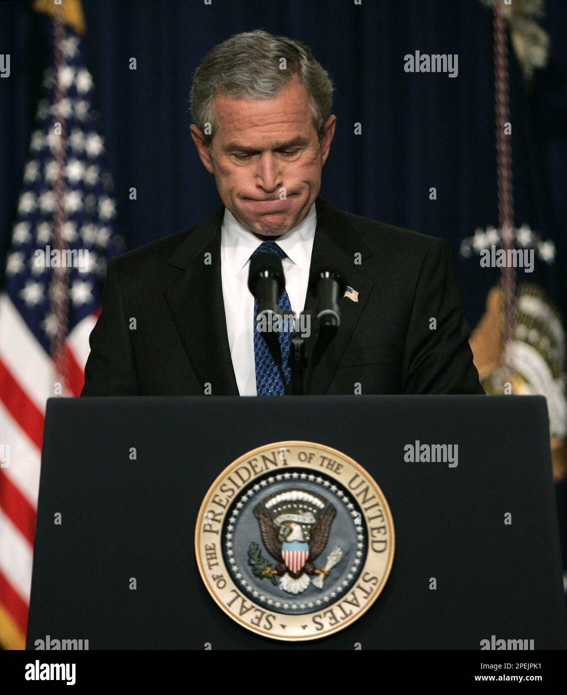 President Bush pauses while answering reporters' questions at his first ...