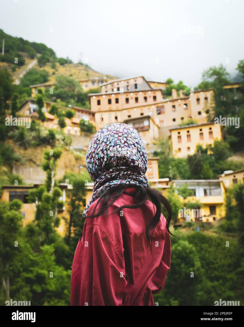 Tourist woman stand enjoy scenic Masuleh village panorama in north east ...