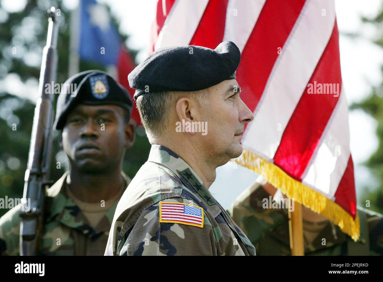 Lt. General James P. Dubik, center, stands at attention as he assumes ...