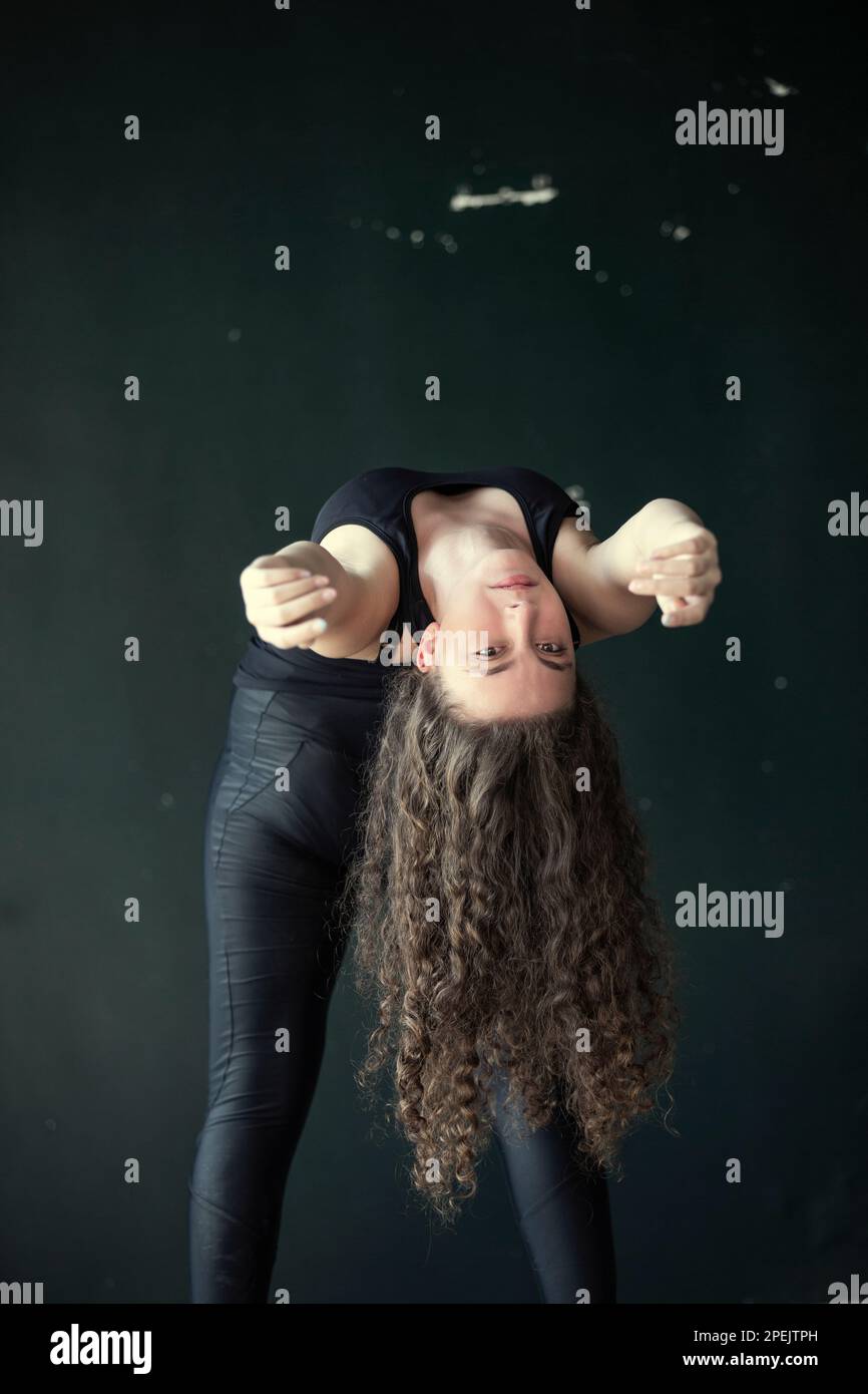 Flexible teenage girl bending backwards Stock Photo - Alamy