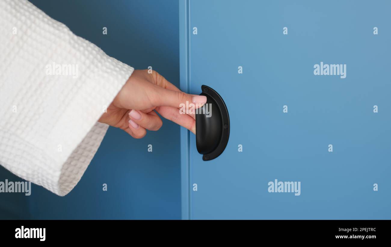 Hand opening kitchen cupboard hi-res stock photography and images - Alamy
