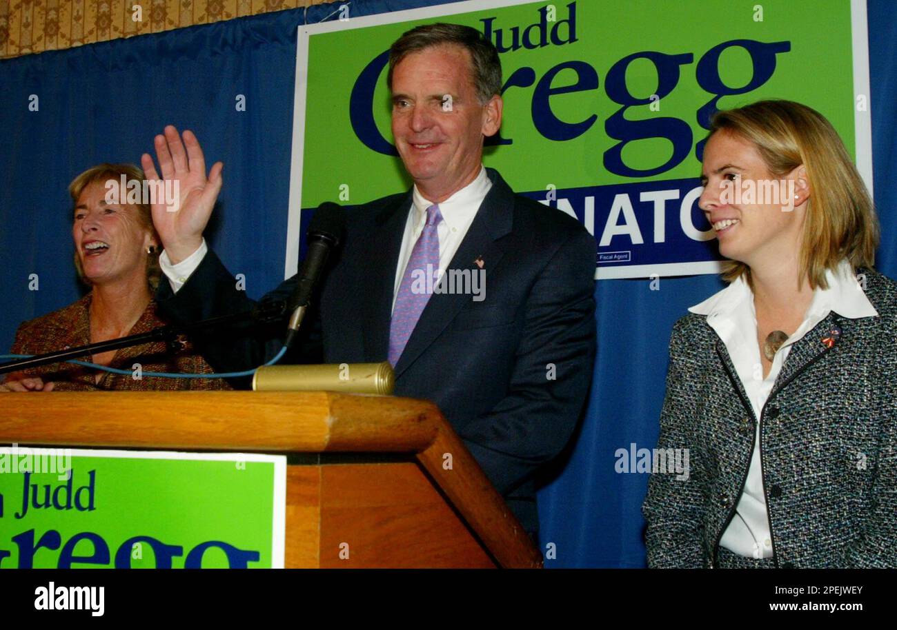 Sen. Judd Gregg, R-NH, flanked by his wife Kathleen, left, and his ...