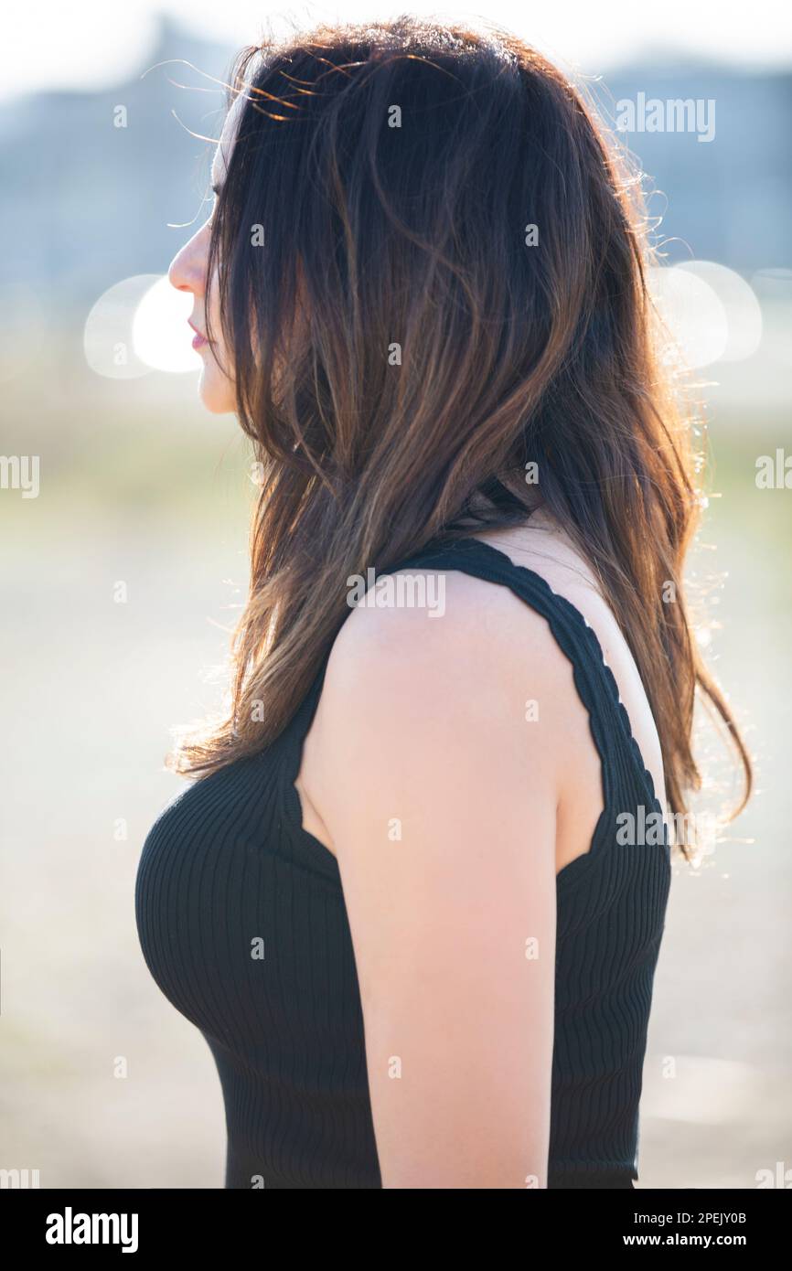 Side view of woman looking away Stock Photo - Alamy