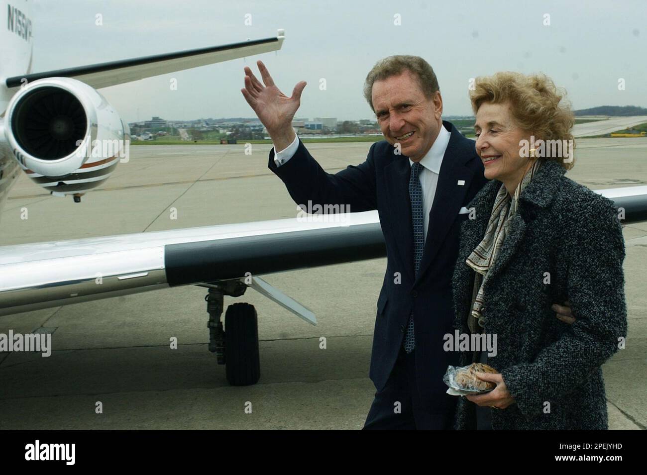 U.S. Sen. Arlen Specter, R. Pa., waves as he walks to a jet to continue ...