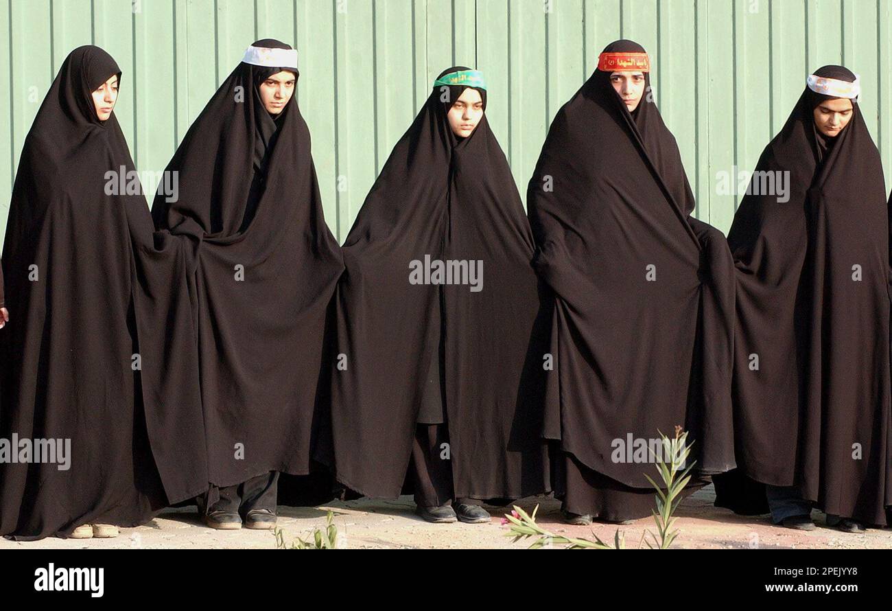 Female Iranian students form a human chain around the Iranian Atomic ...