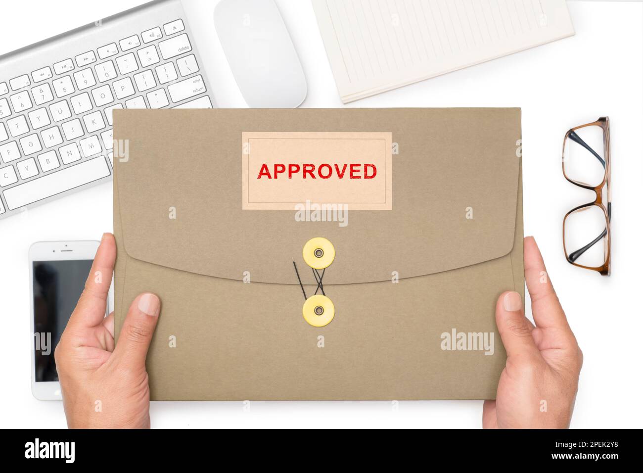 Man's hand holding approved paper folder or important information for ...