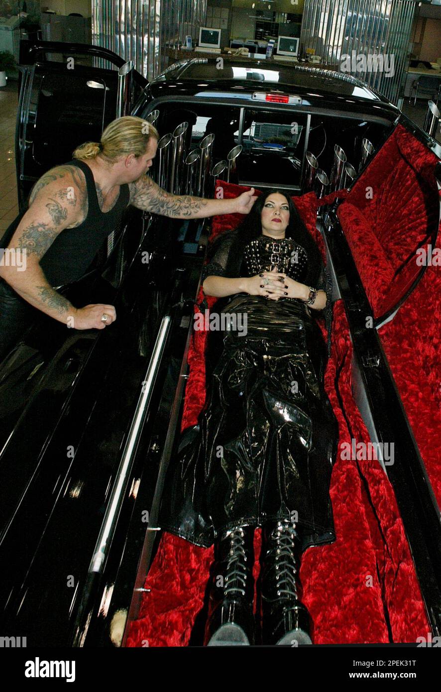 Gothic fans Steve Lusk adjust the head-rest for his wife Andrea Lusk ...