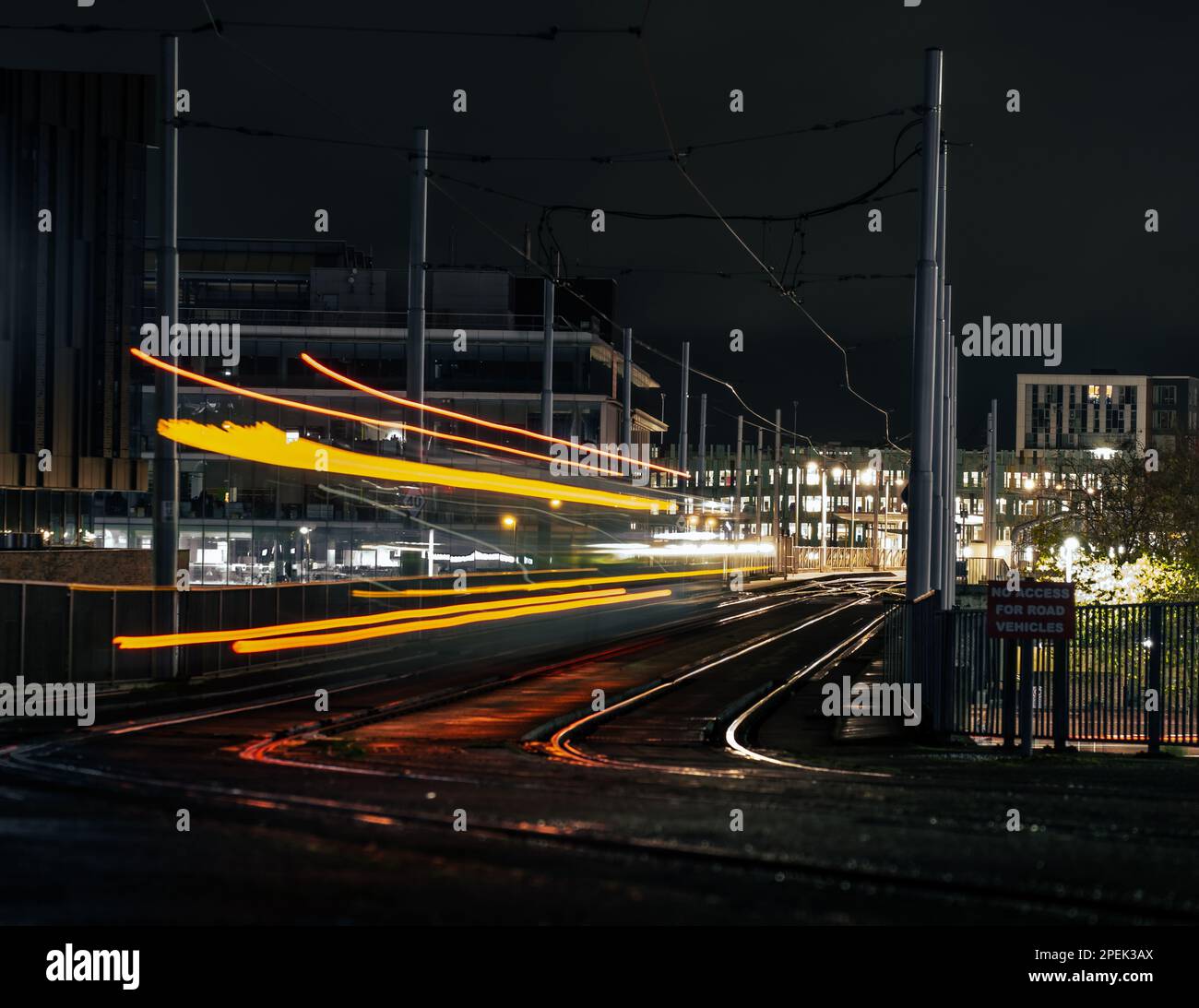 A long exposure shot of the light trails of the train over the railway ...