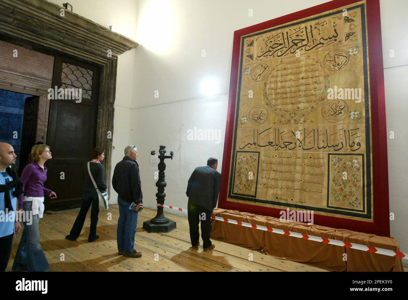 Visitors look at what is said to be the world's largest calligraphy on ...