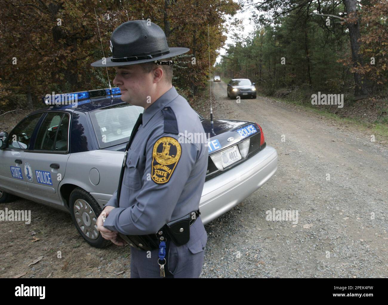 Virginia State Trooper Dale Reed stands guard outside the scene of an ...