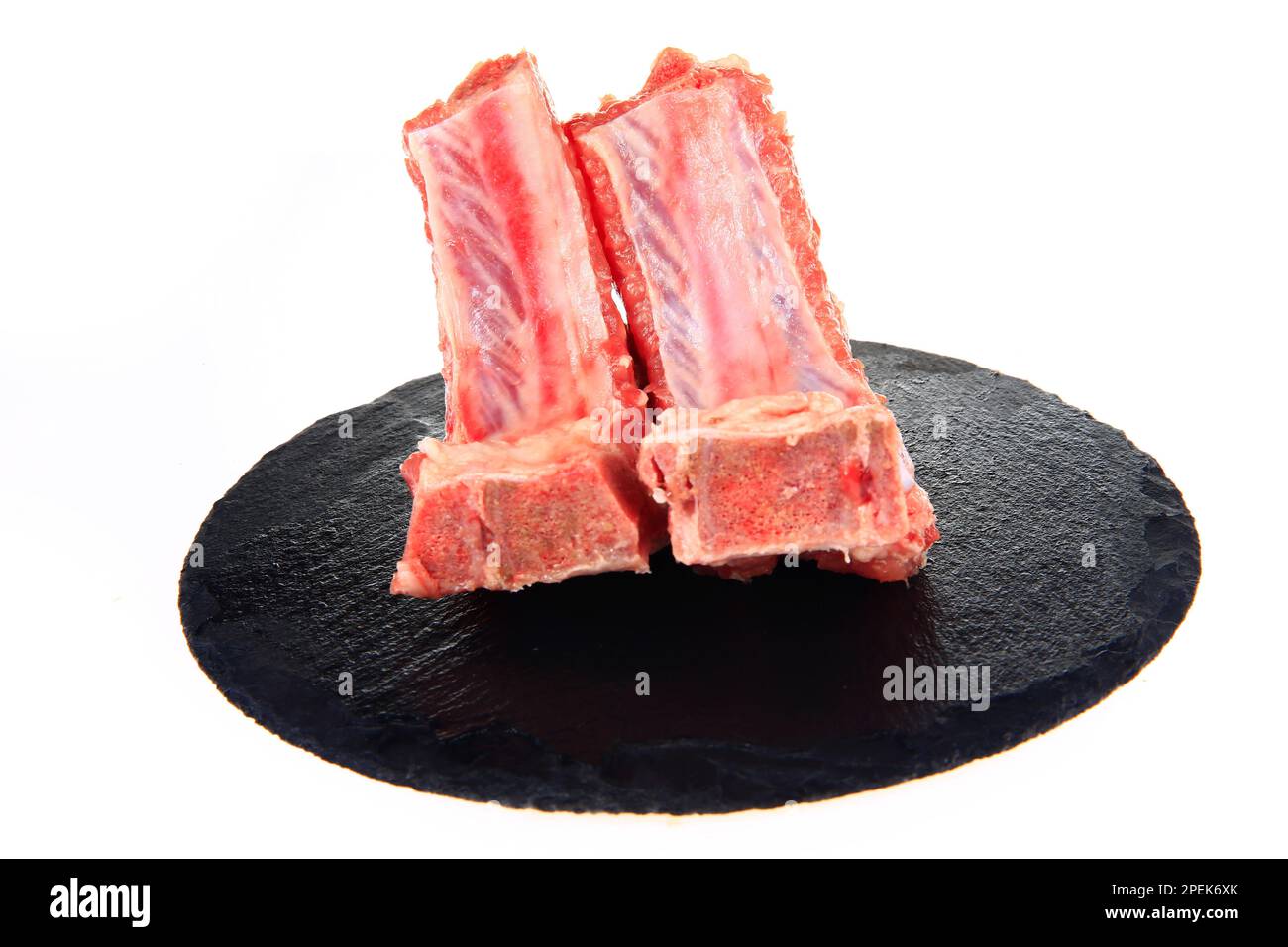 Fresh pork chop on a white background, close-up shot Stock Photo - Alamy