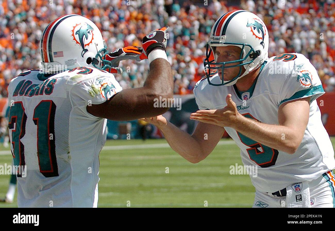 Miami Dolphins' Sammy Morris (31) is congratulated by quarterback Jay ...
