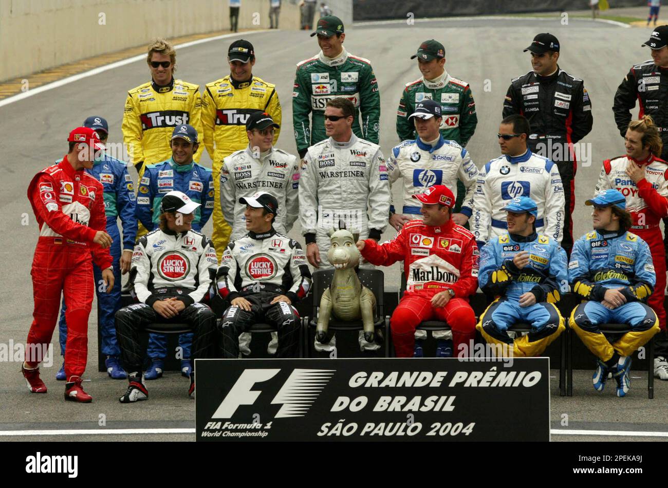Ferrari's Michael Schumacher, left, arrives for the official drivers ...