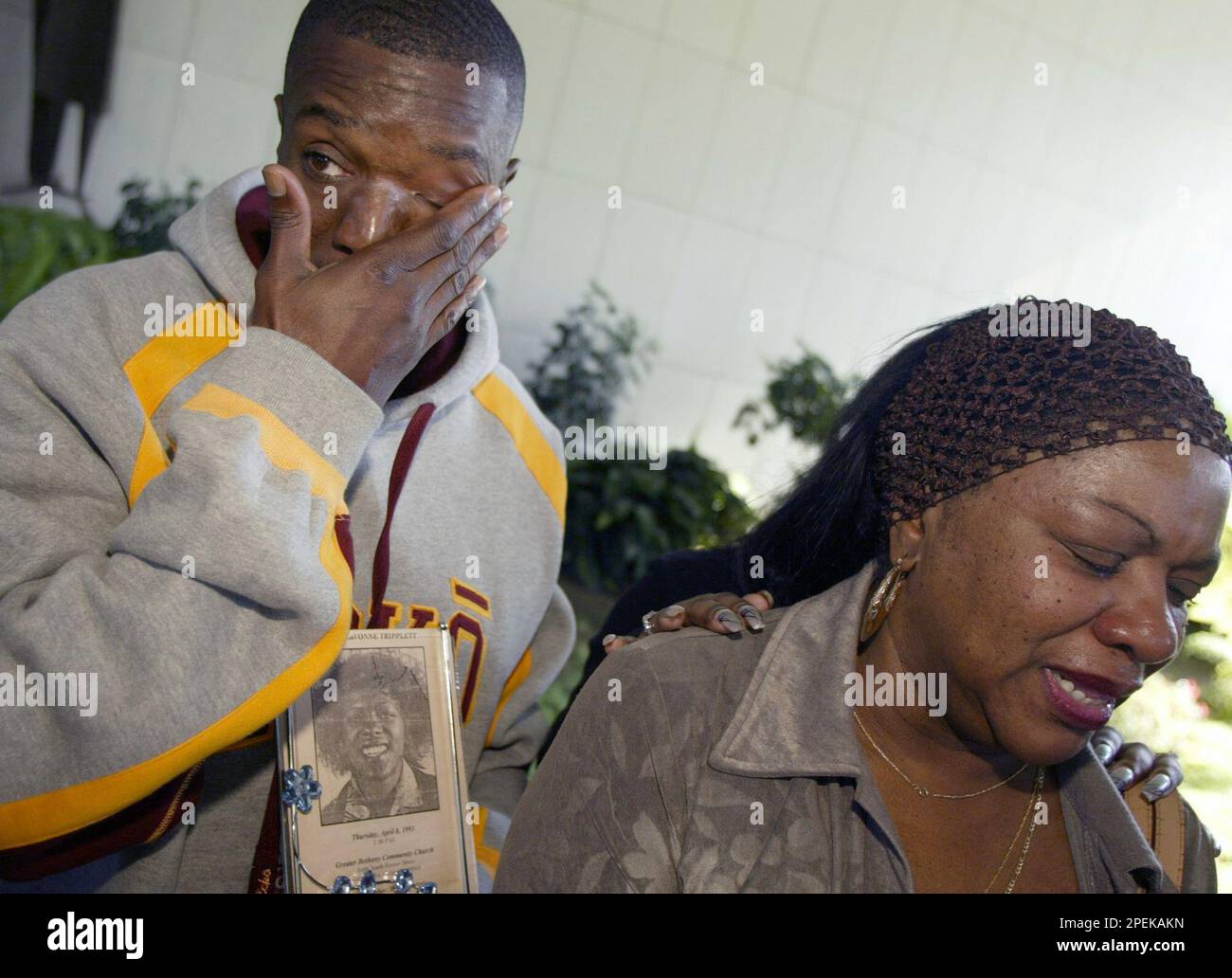 Family member George Williams, left, and Jerri Johnson, mother of ...