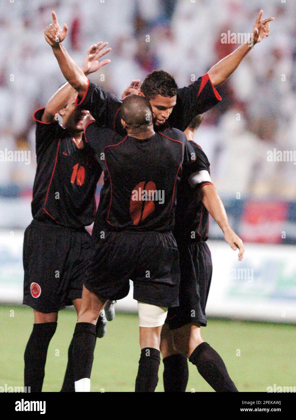 Rayyan Club's Brazilian super star Sonny Anderson, center, celebrates ...