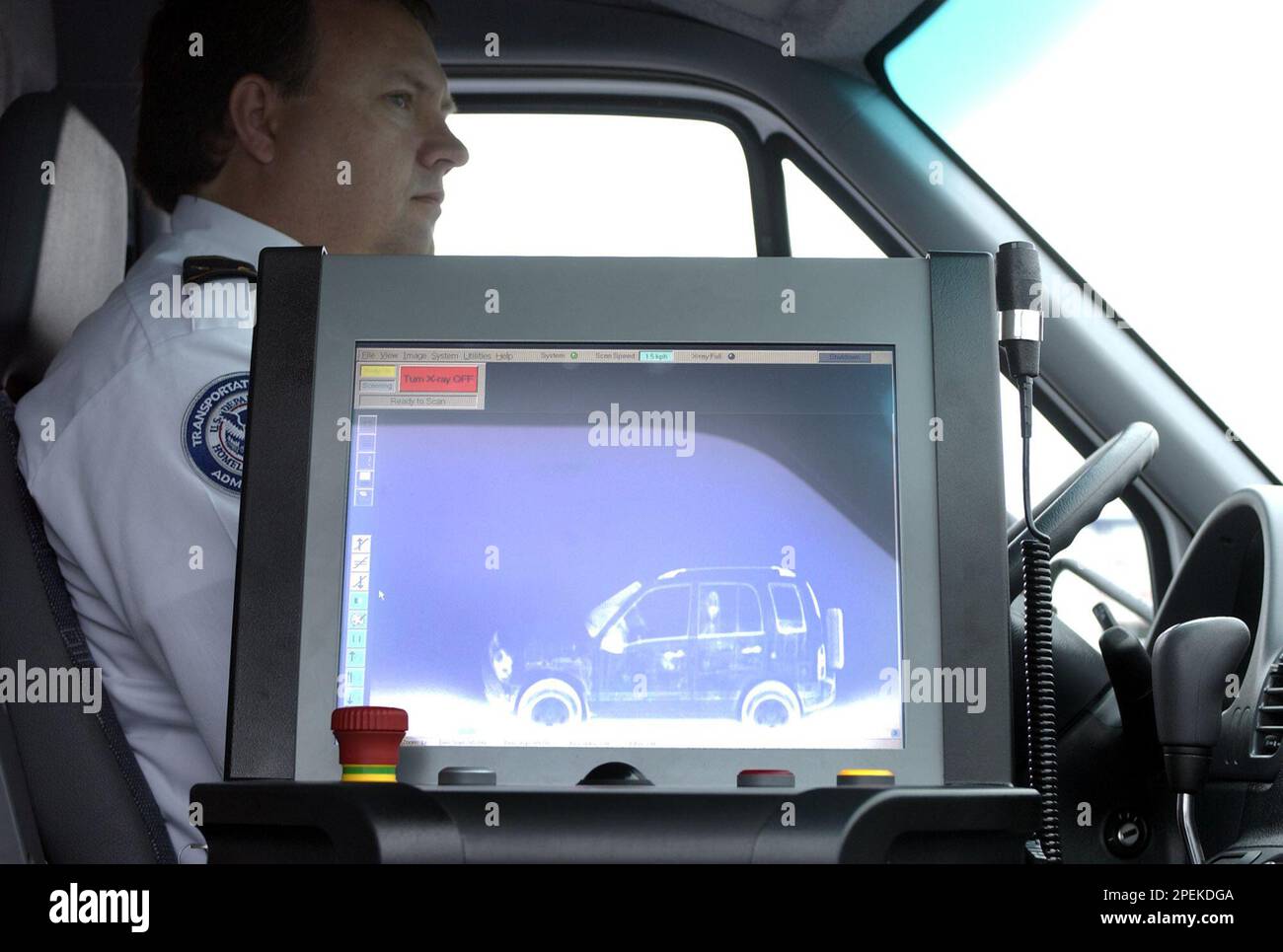 A Transportation Security Administration screener shows one of the ...