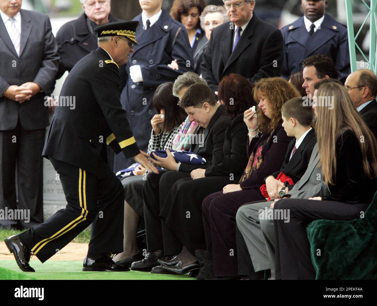 Dean Cunningham, son of Army Staff Sgt. Darren Cunningham, weeps as ...