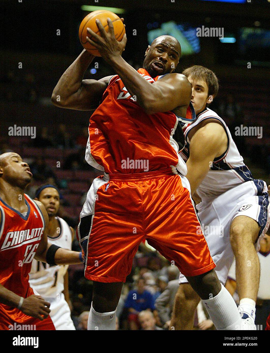 Charlotte Bobcats' Jahidi White (55), foreground, grabs the rebound ...