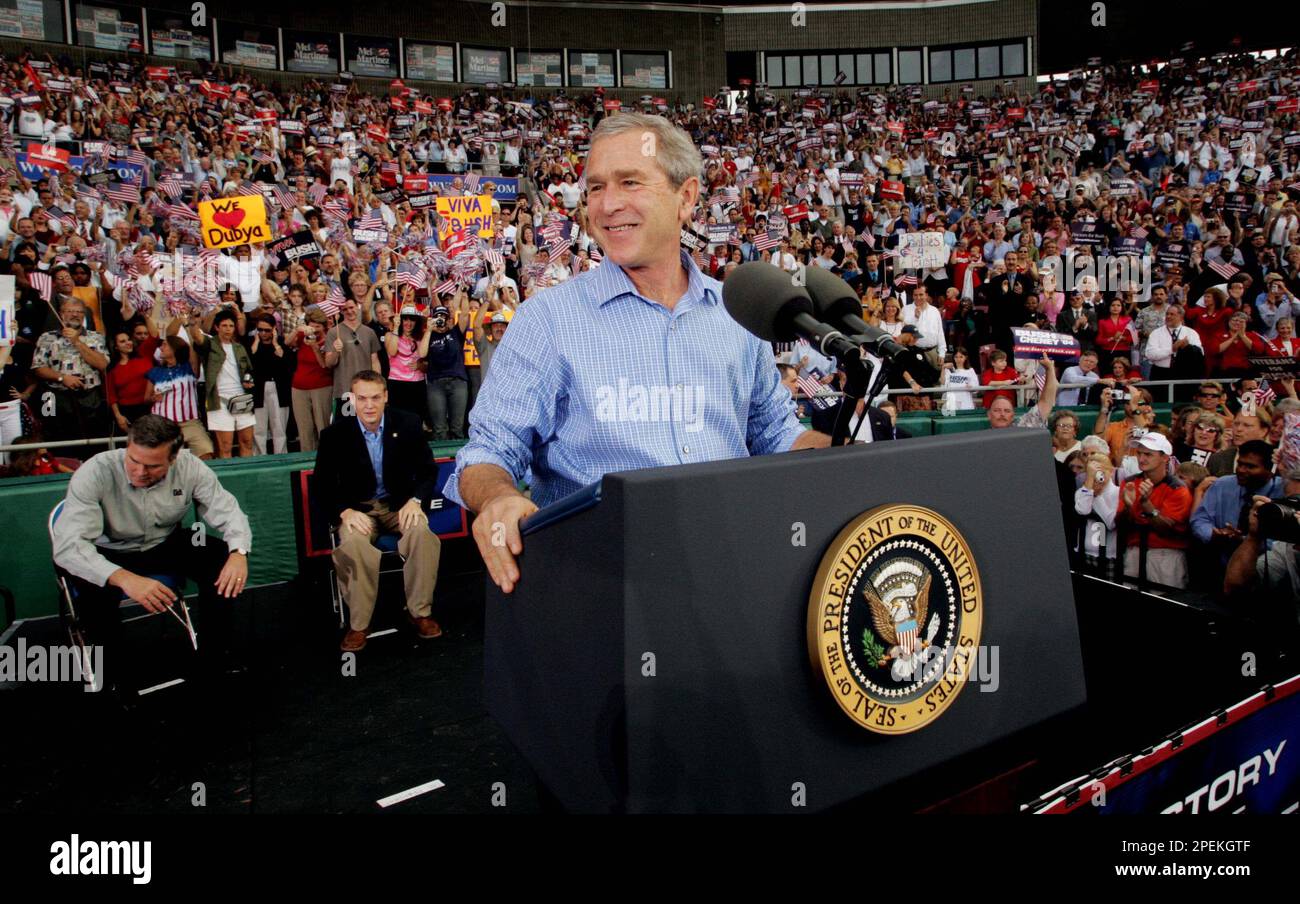 President Bush smiles as he receives cheers from supporters after being ...