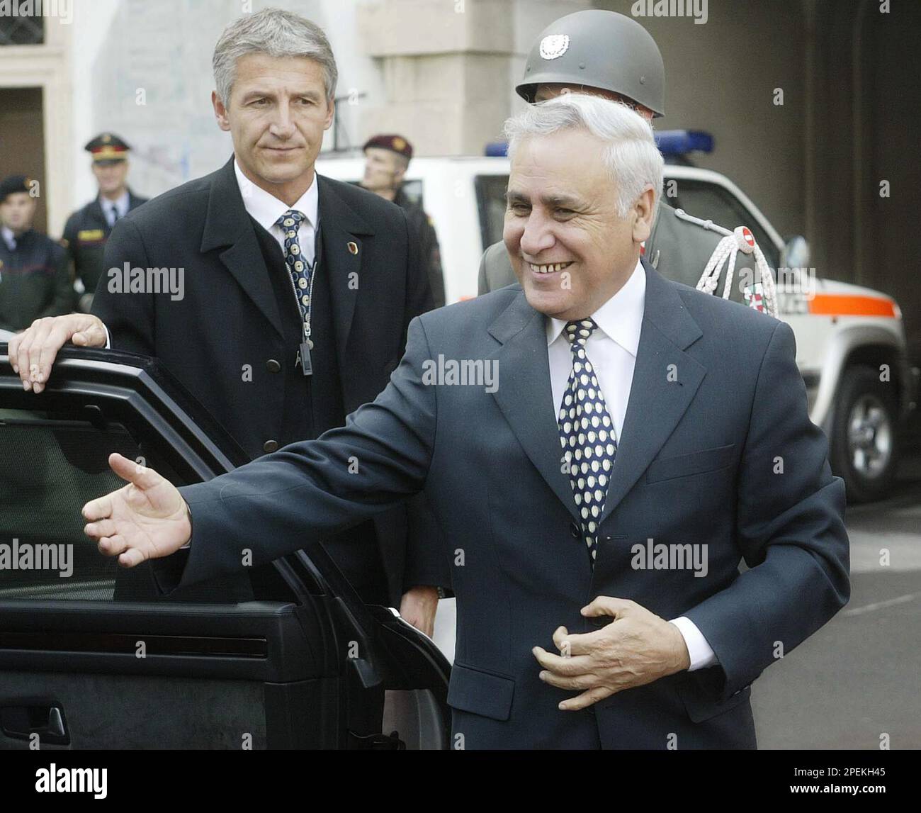 Israeli President Moshe Katsav gestures upon his arrival in front of ...