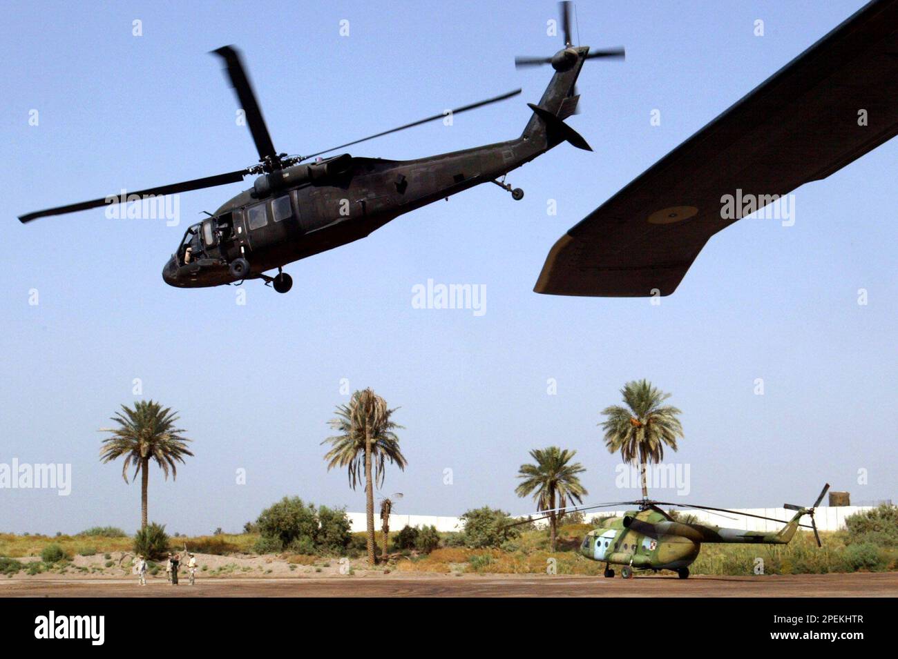 A U.S. Army blackhawk helicopter takes off from a base at Babylon south ...