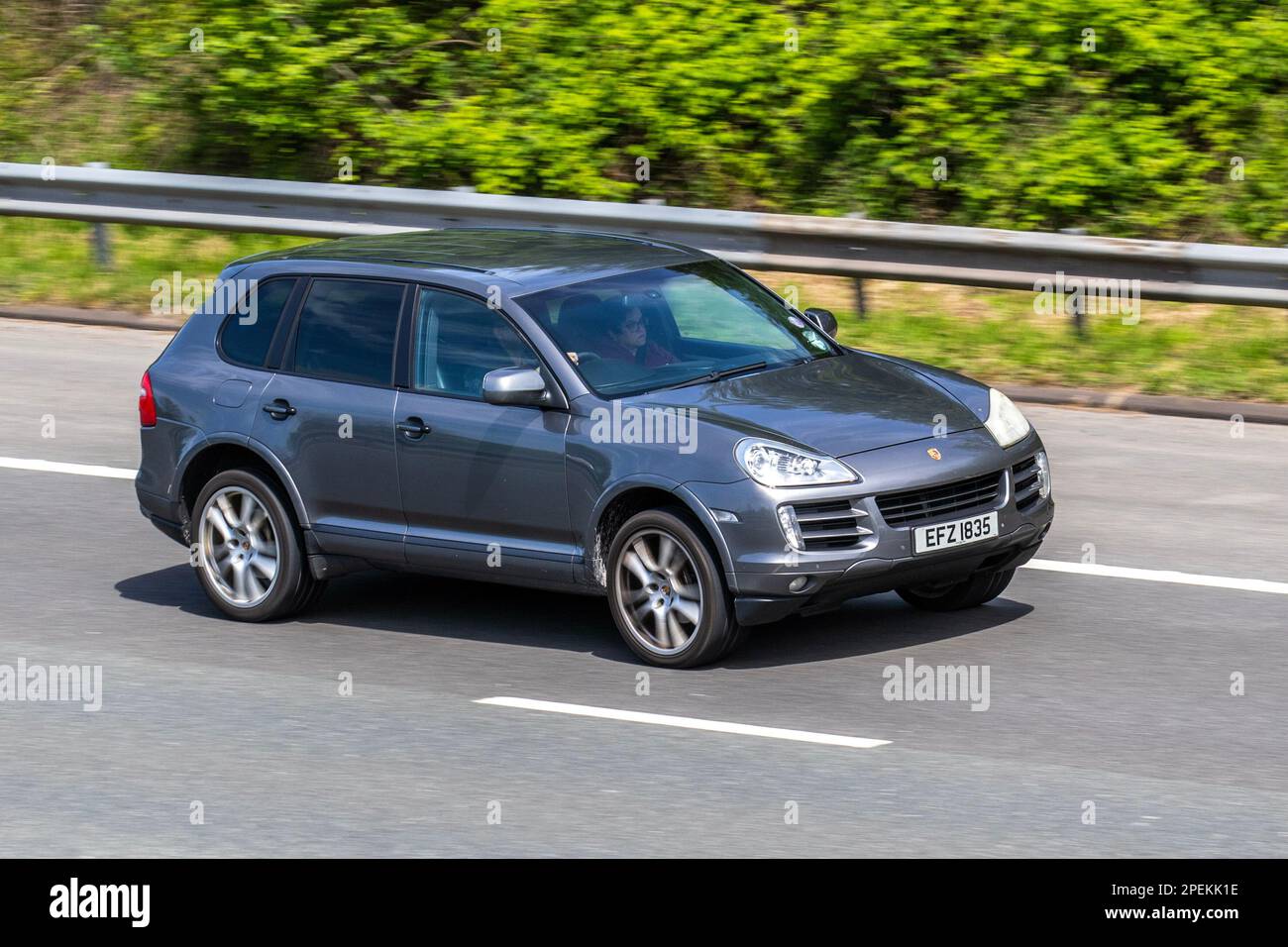 2008 Grey Porsche Cayenne Tiptronic, two-tonne-plus petrol-engined SUV; travelling on the M6 ...