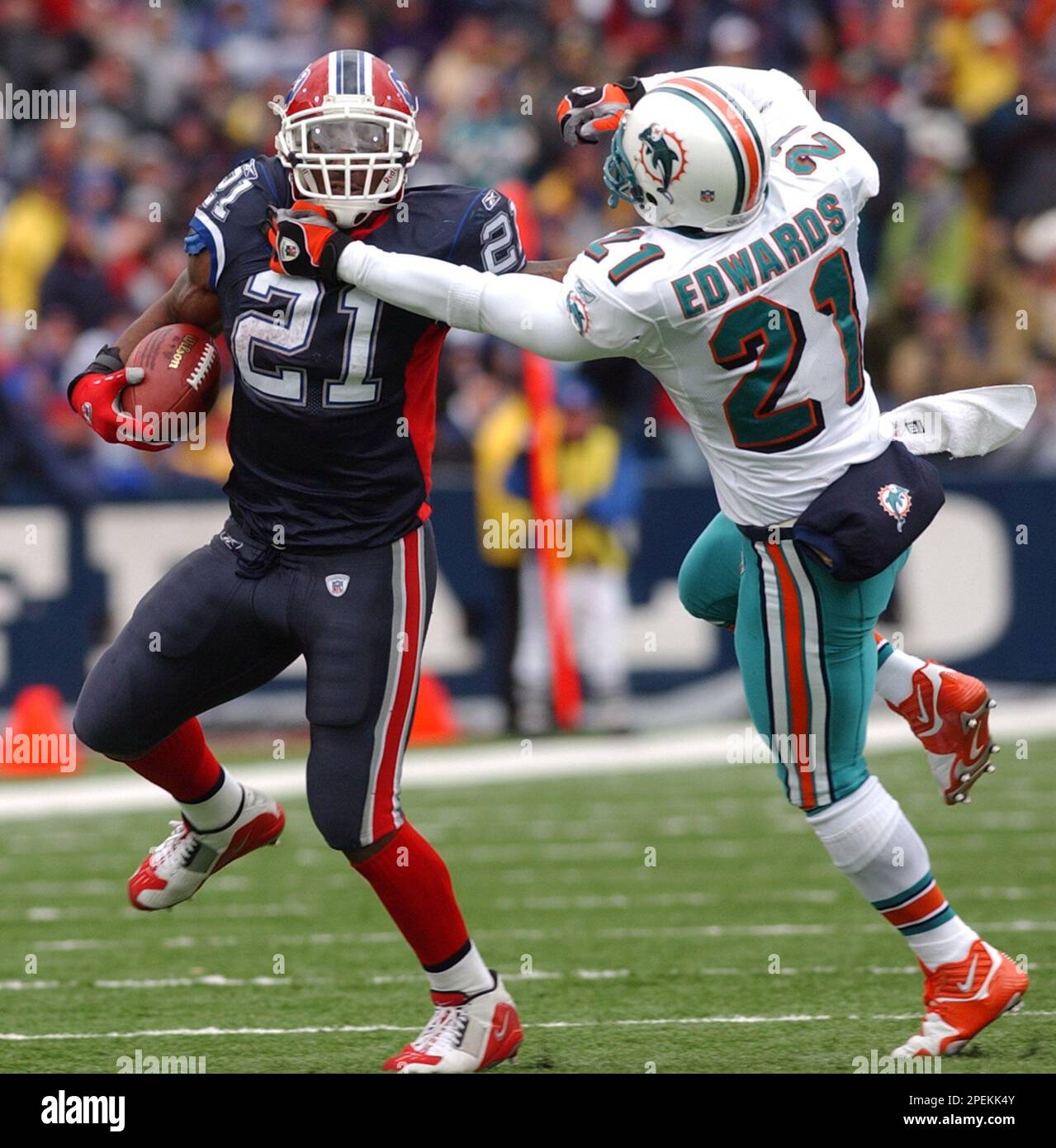 Buffalo Bills' Willis McGahee (21) pushes off of Miami Dolphins' Antuan ...