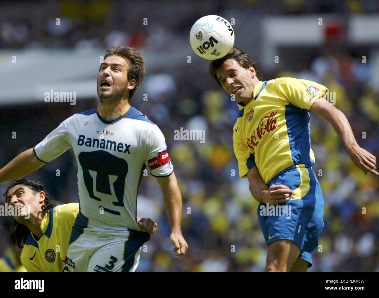 America's soccer player Horacio Ameli, right, heads the ball as Puma's ...