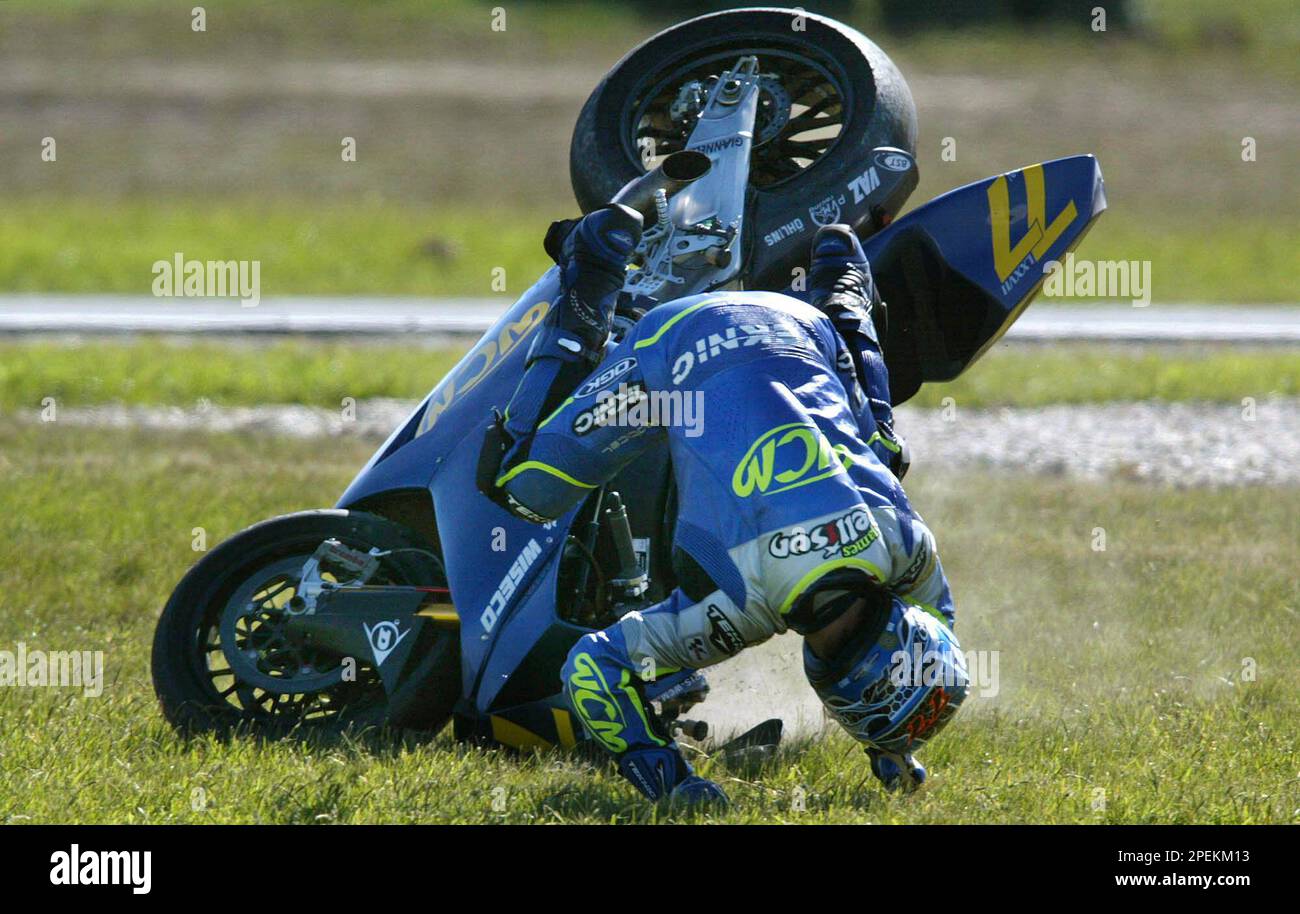 British MotoGP rider James Ellison on his Harris WCM takes a tumble in ...