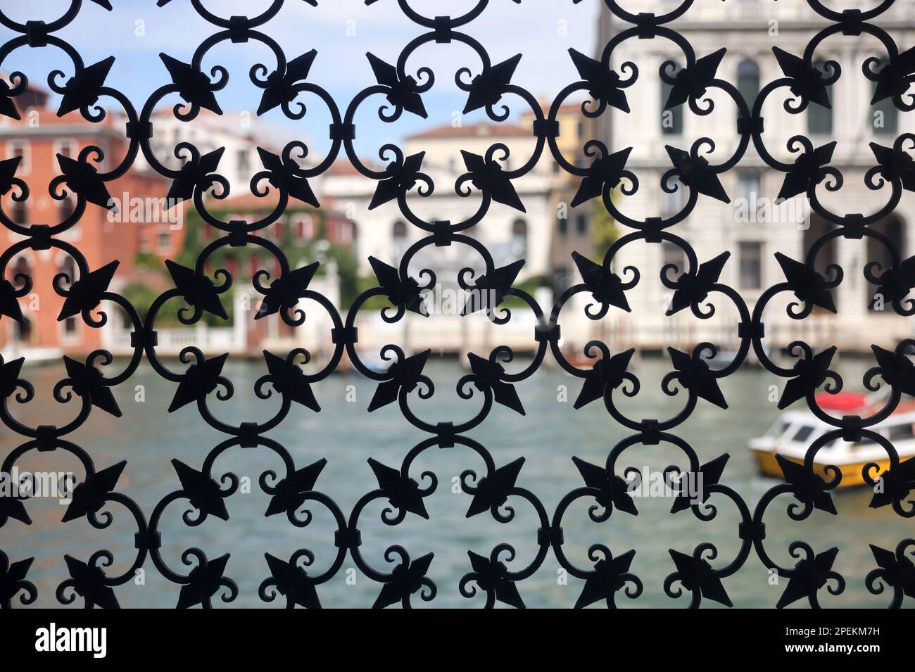 Detail of an ancient window with grating in wrought iron. Venice, Italy ...