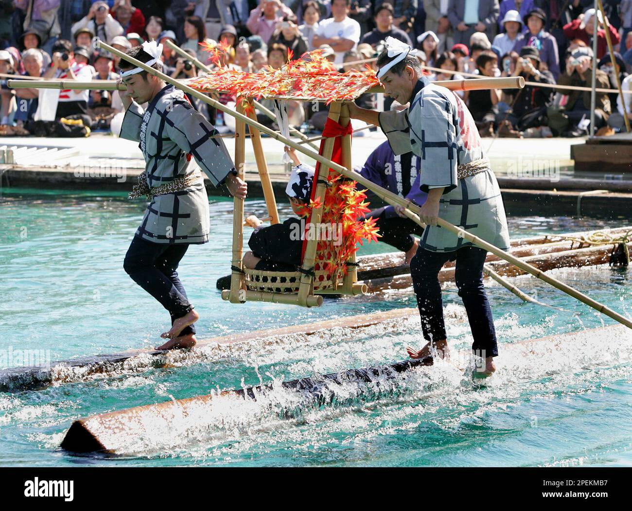 Amateur stunt performers in traditional lumberman costume carry a ...