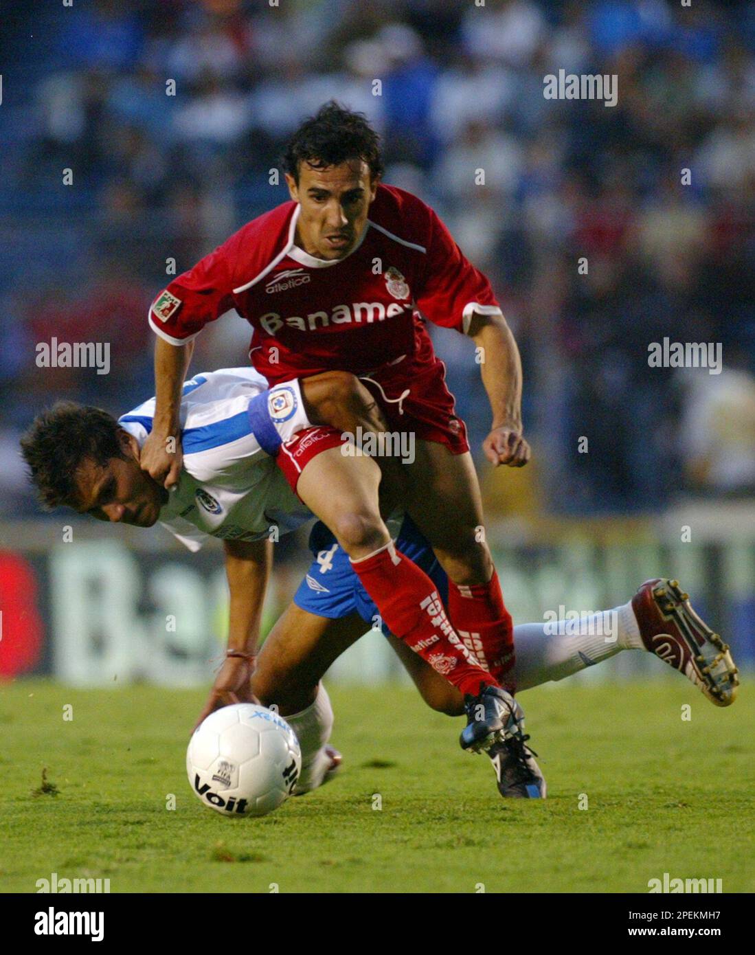 Toluca's Vicente Sanchez,front, from Uruguay is fauled by Cruz Azul's ...