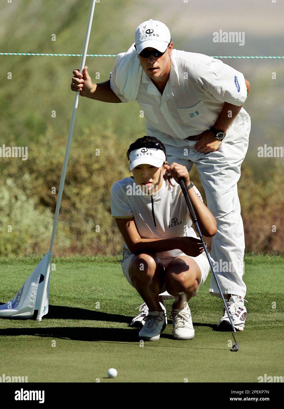Shi Hyun Ahn of South Korea, lines up a putt with her caddie, Brian ...