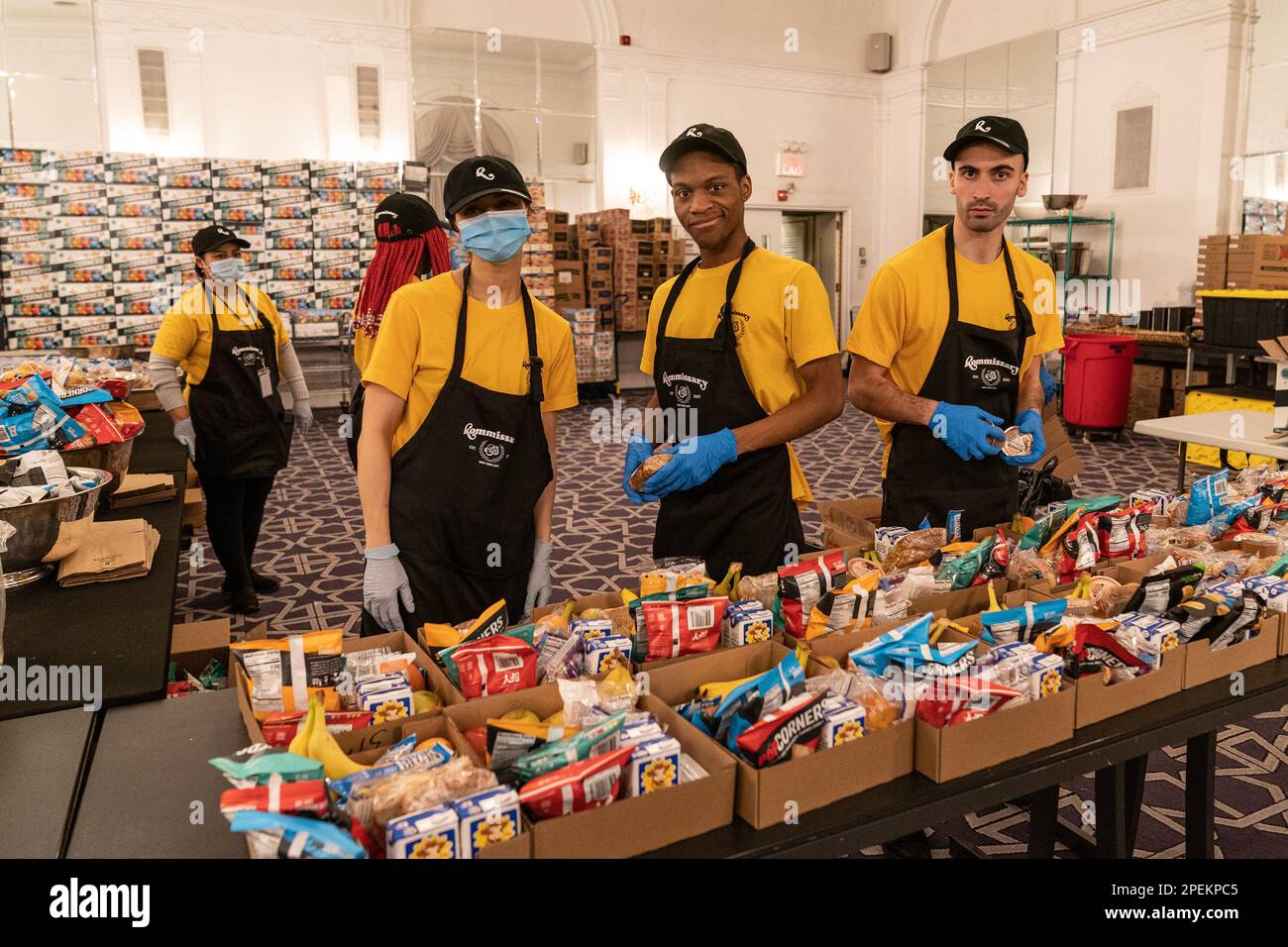 New York, USA. 15th Mar, 2023. Volunteers prepare food for asylum ...