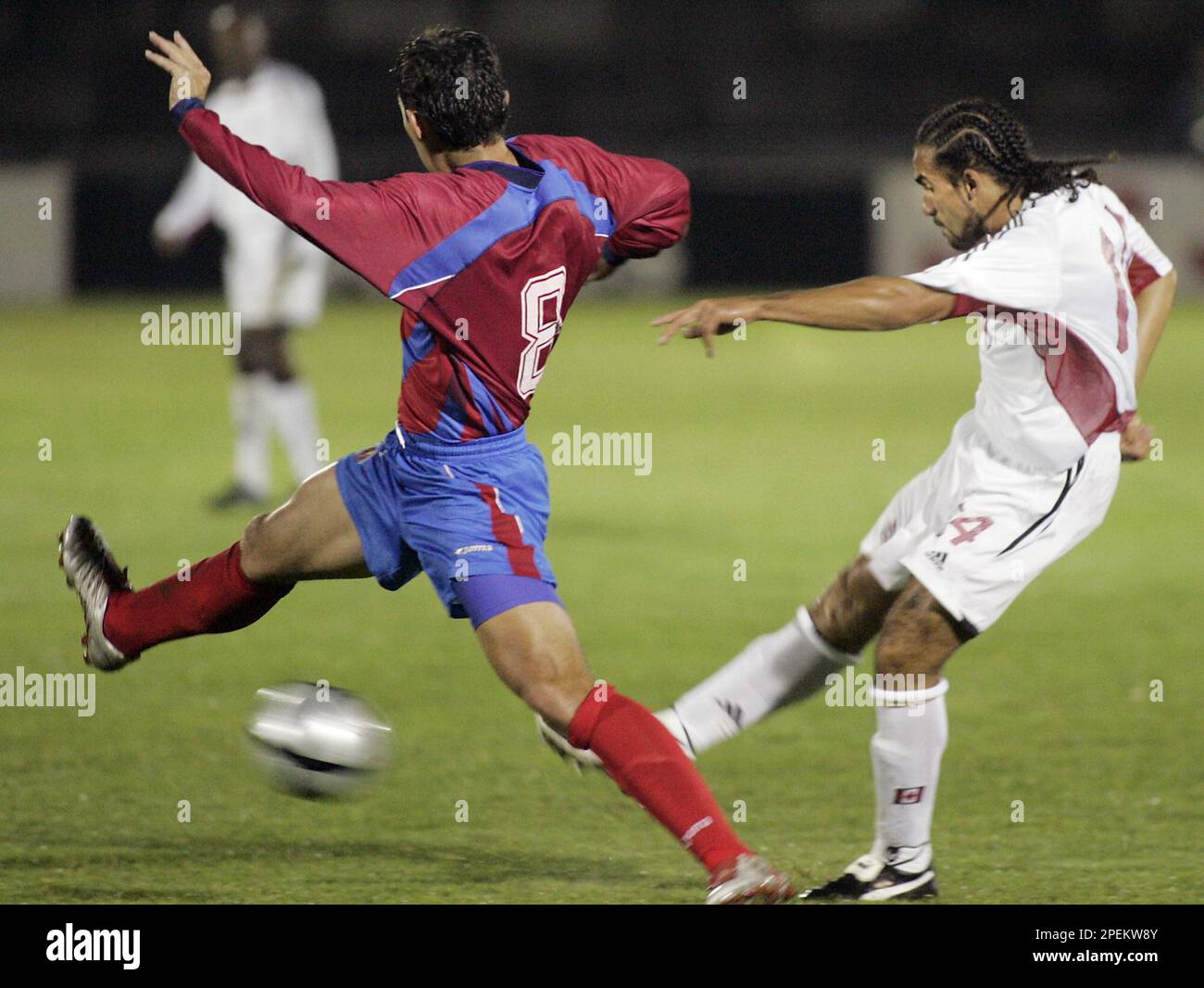 Canada's Dwayne de Rosario, right, kicks the ball past Costa Rica ...
