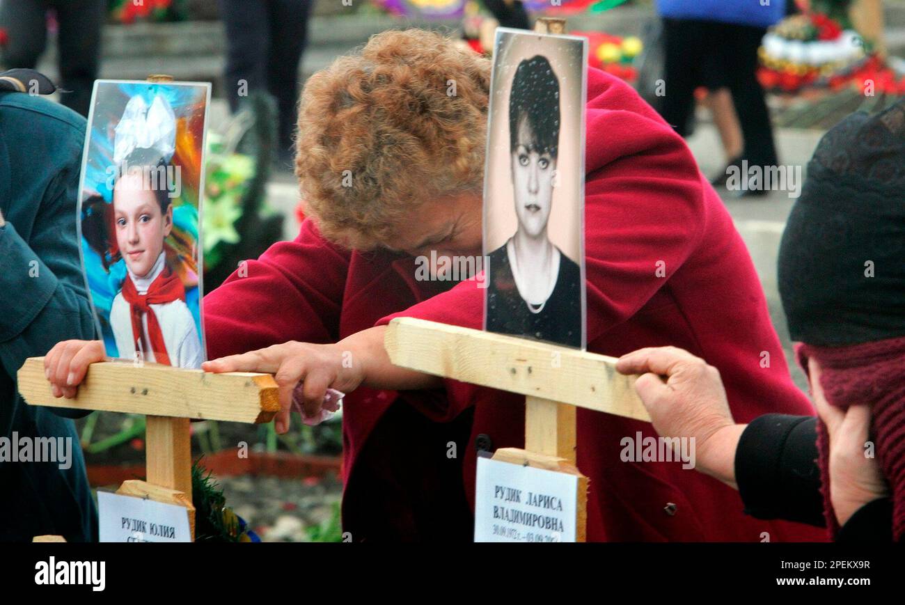 Relatives of Yuliya Rudik, 14, and her mother Larisa Rudik, 32, mourn ...