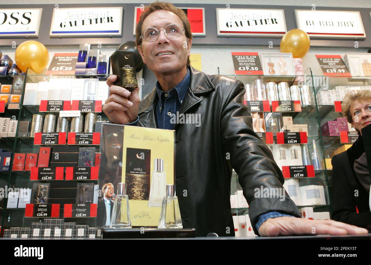 British pop music legend Sir Cliff Richard poses with a bottle of his ...