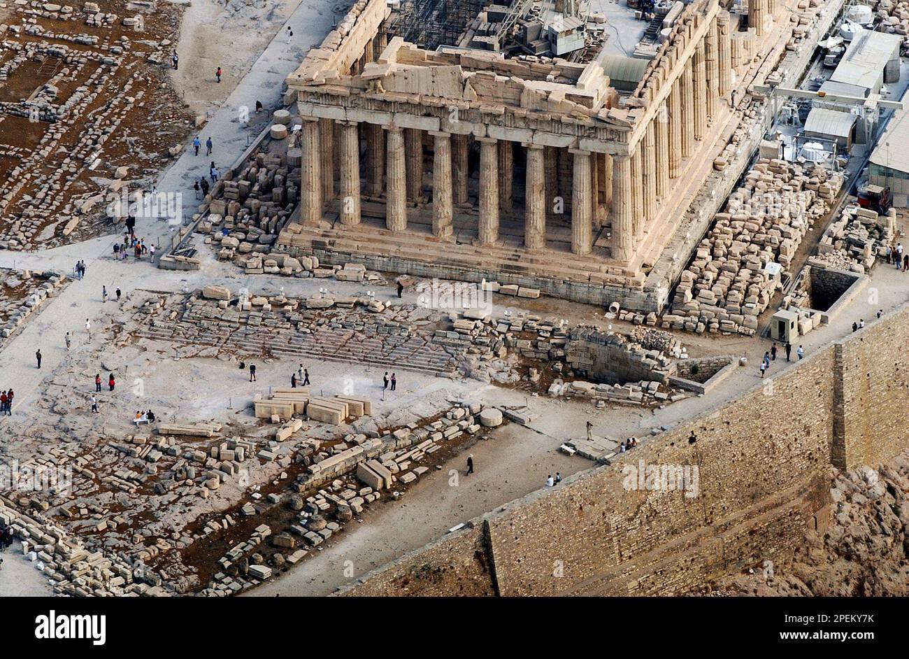 Visitors are seen outside the ancient Parthenon temple in Athens ...