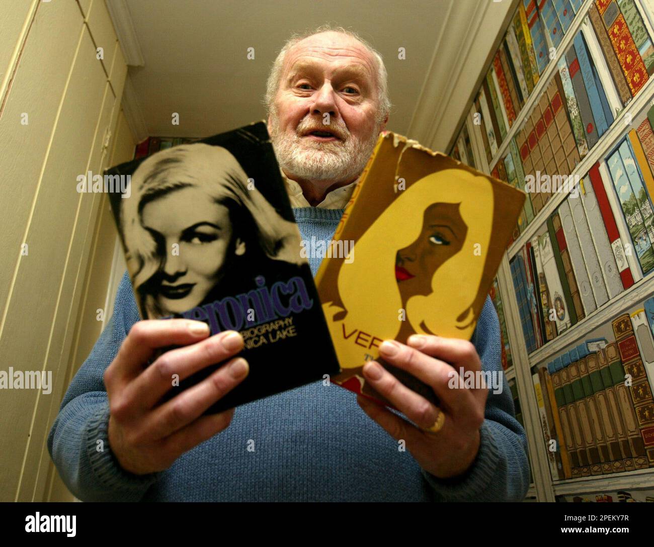 Donald Bain holds two versions of the cover of his biography on actress ...