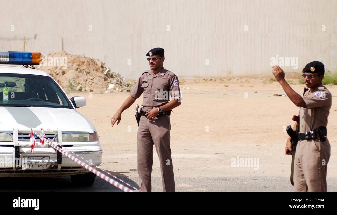 Saudi policemen stand guard near the house in eastern Riyadh where ...