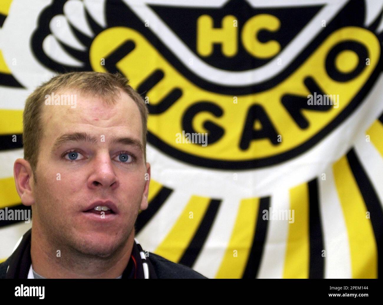 Canada's Alex Tanguay poses in front of his new team's logo as he is ...