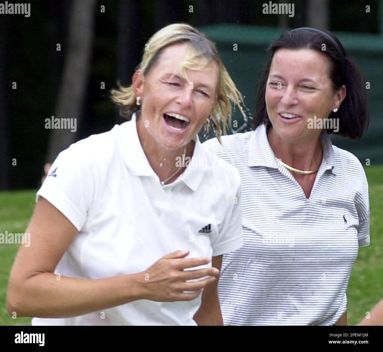 Sweden's Liselotte Nuemann, left, reacts after golfer Sherri Steinhouer ...
