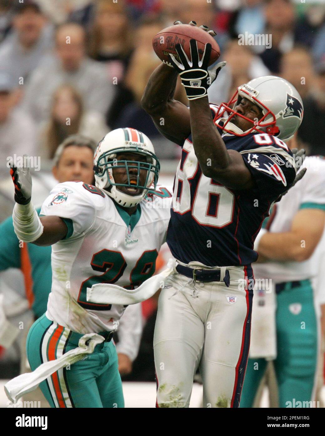 New England Patriots receiver David Patten hauls in a pass in front of ...